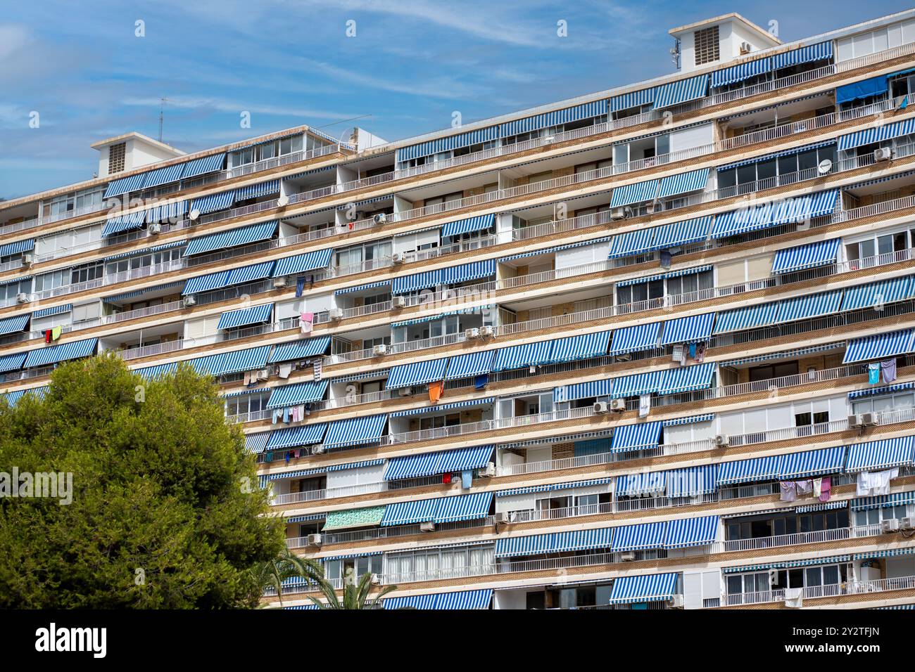 A multi-story residential building in Alicante, Spain featuring blue ...