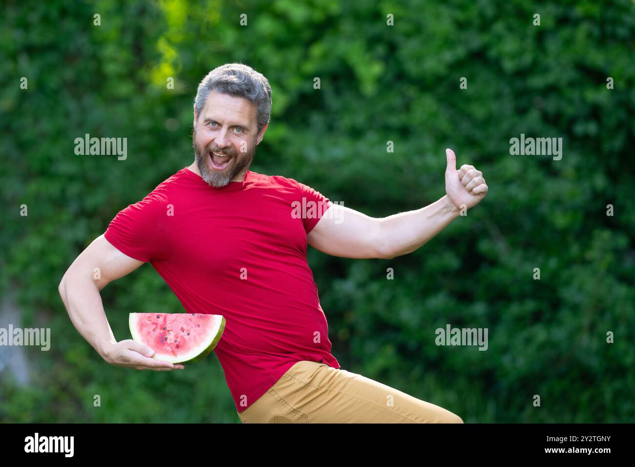 Funny Male face with watermelon, close up. Excited man eating ...