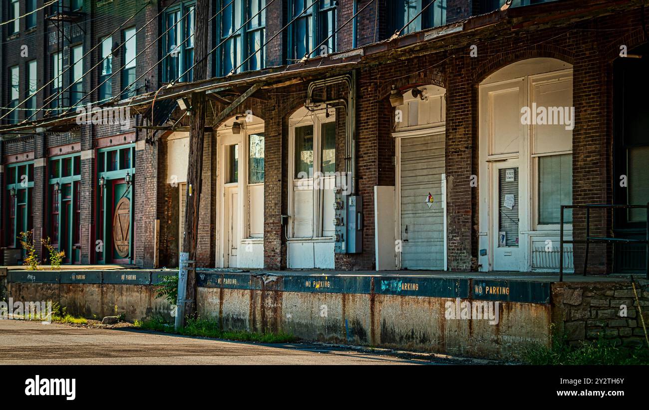 An old industrial building with brick facade and loading docks ...