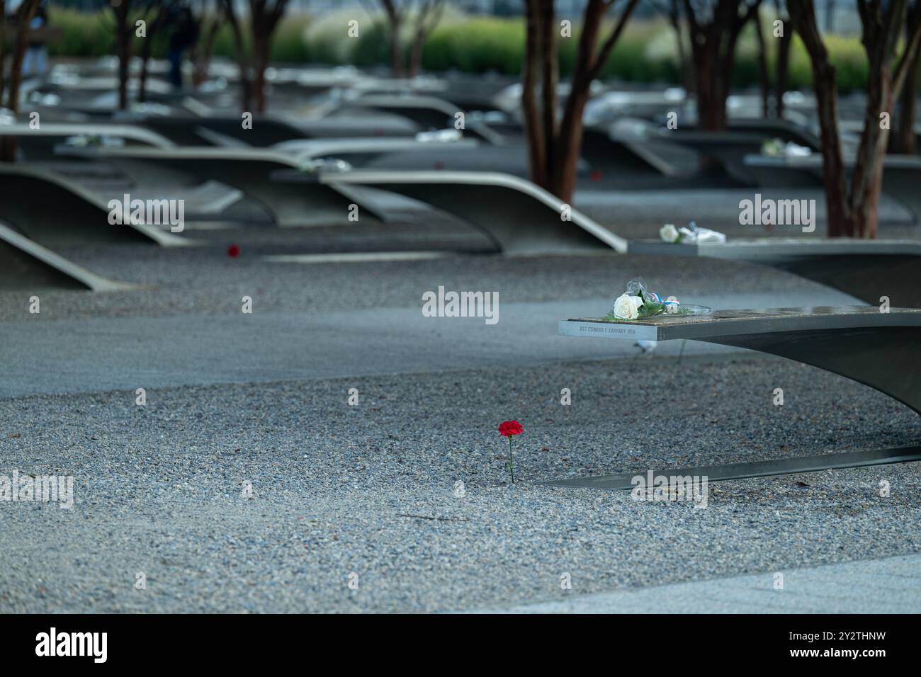 Arlington, United States. 11th Sep, 2024. Flowers are placed on the ...