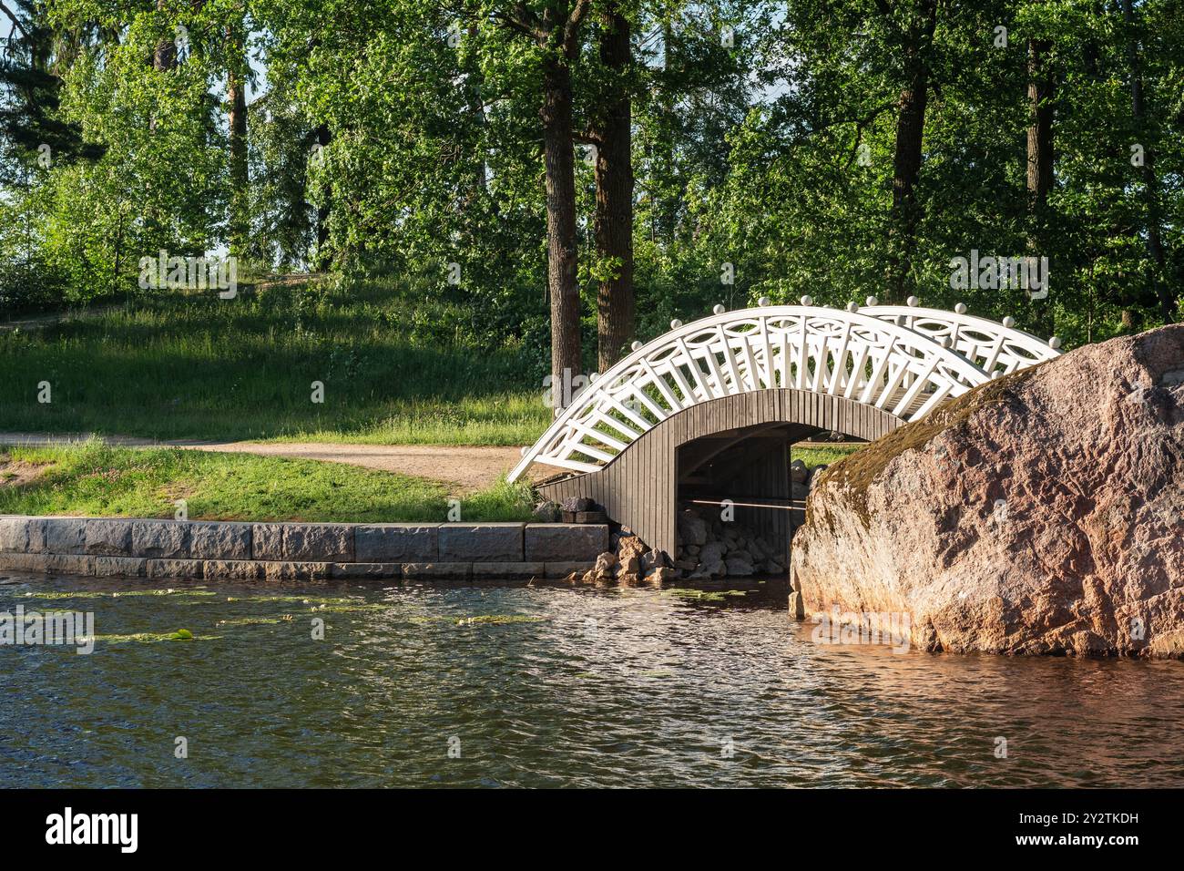 arched wooden pedestrian bridge in the park Stock Photo - Alamy