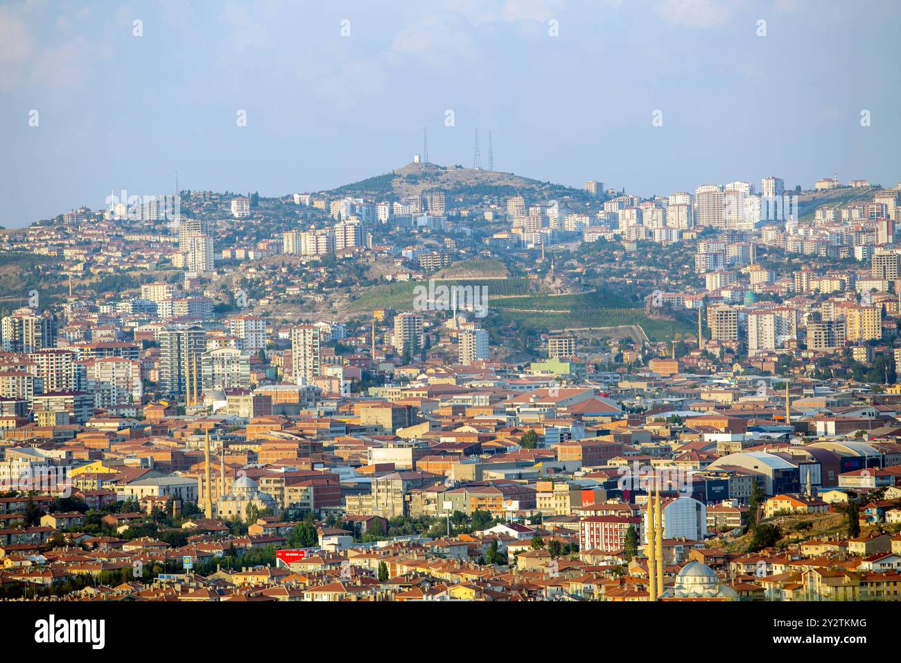 A sprawling cityscape with high-rise apartment buildings, nestled ...