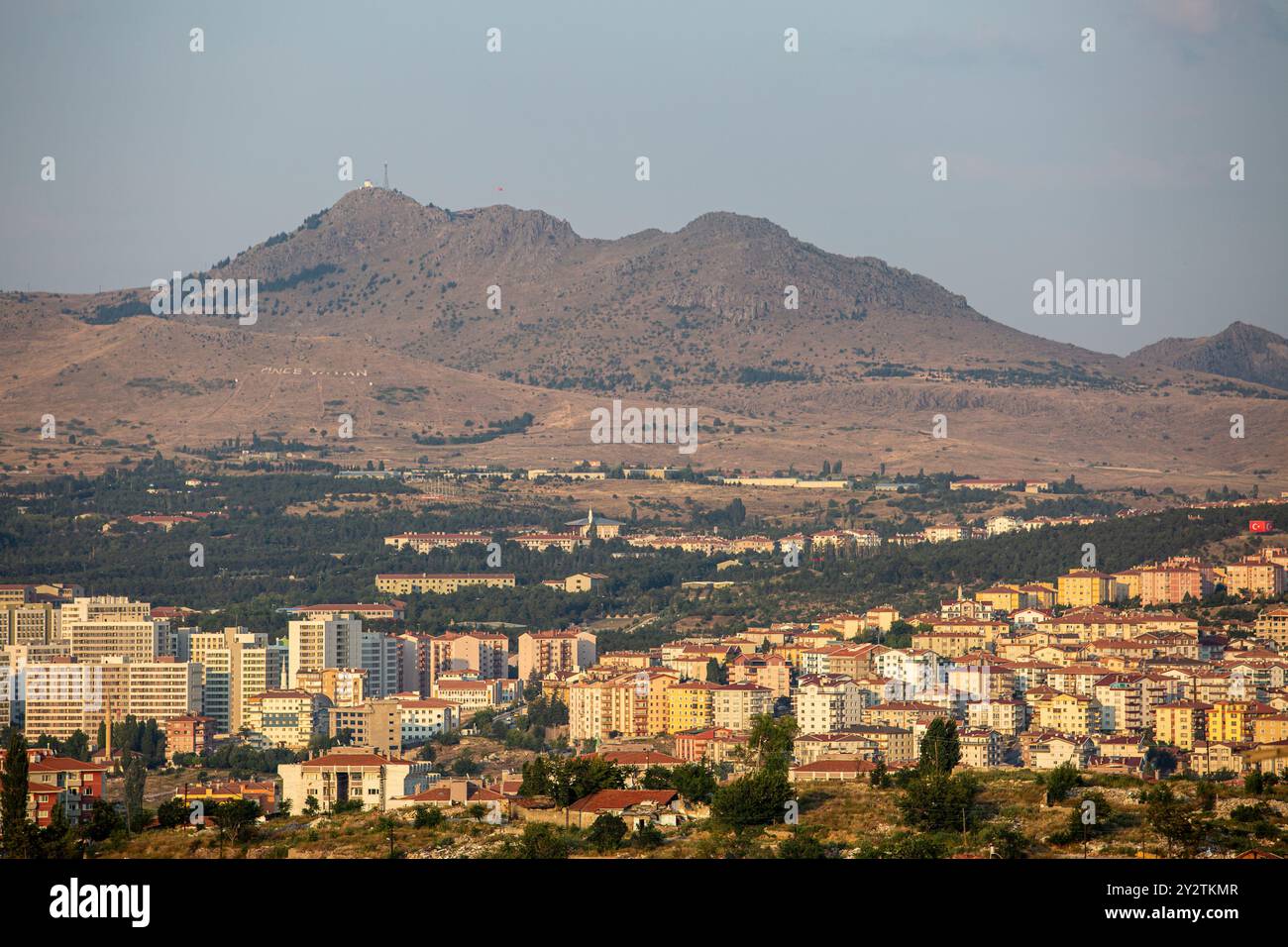 A sprawling cityscape with high-rise apartment buildings, nestled ...