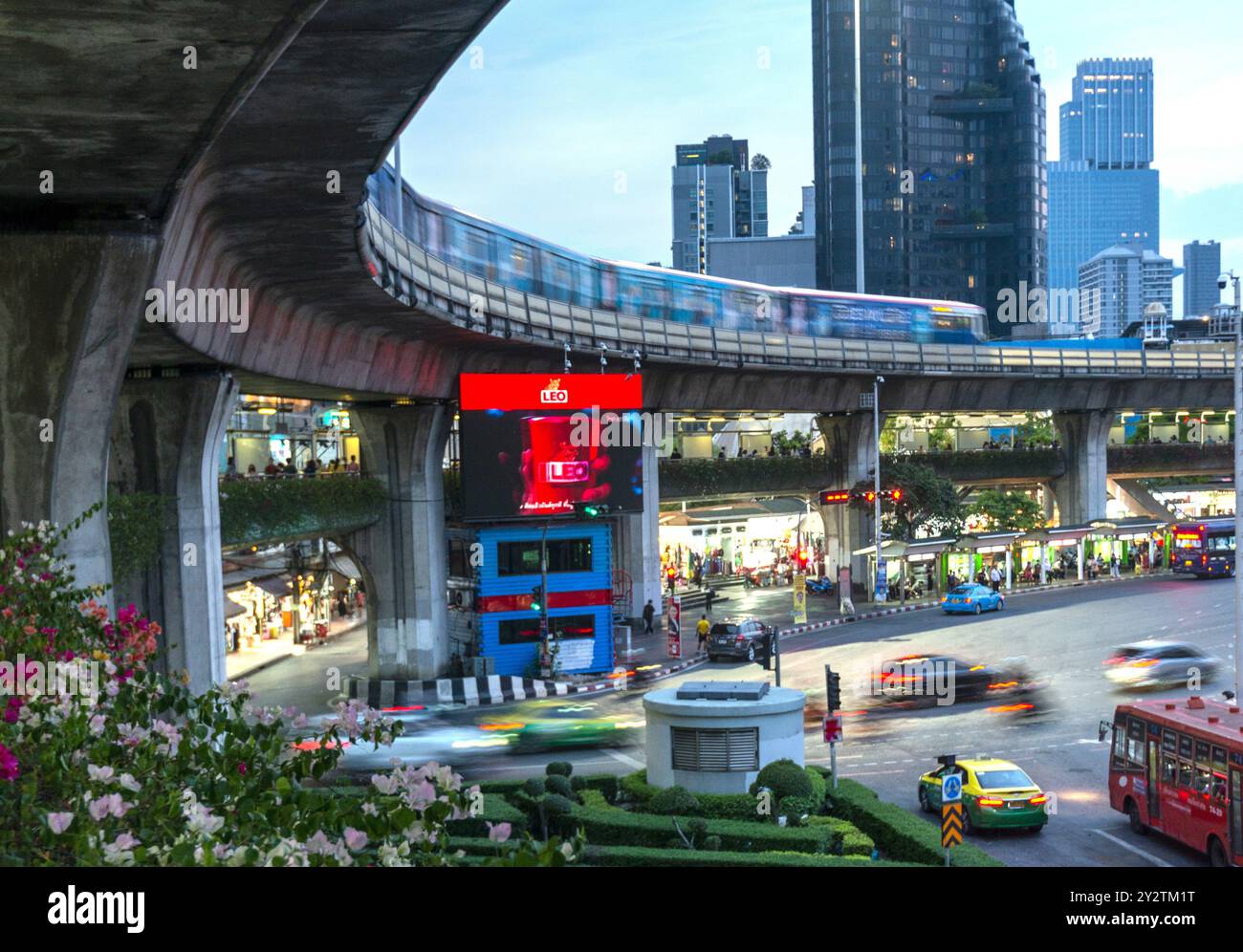 BTS Skytrain rushes overhead,around Victory Monument traffic circle ...