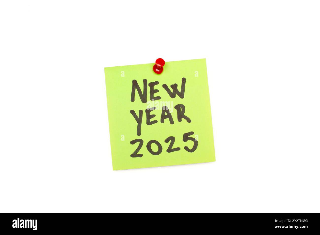 New year 2025 handwritten on a green sticky paper on a white background ...