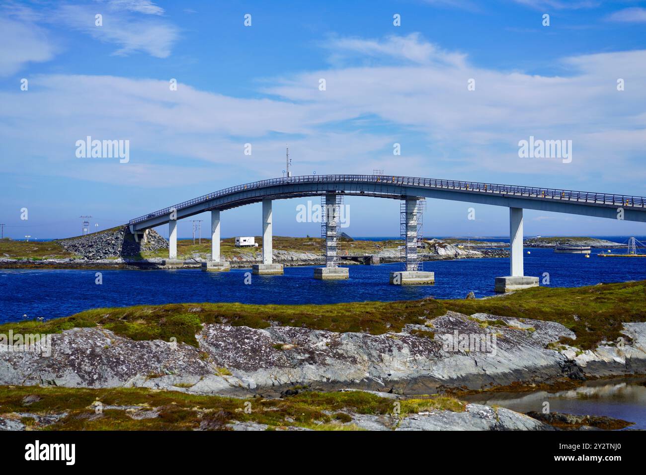 A stunning view of the Atlantic Ocean Road bridge in Norway with clear ...