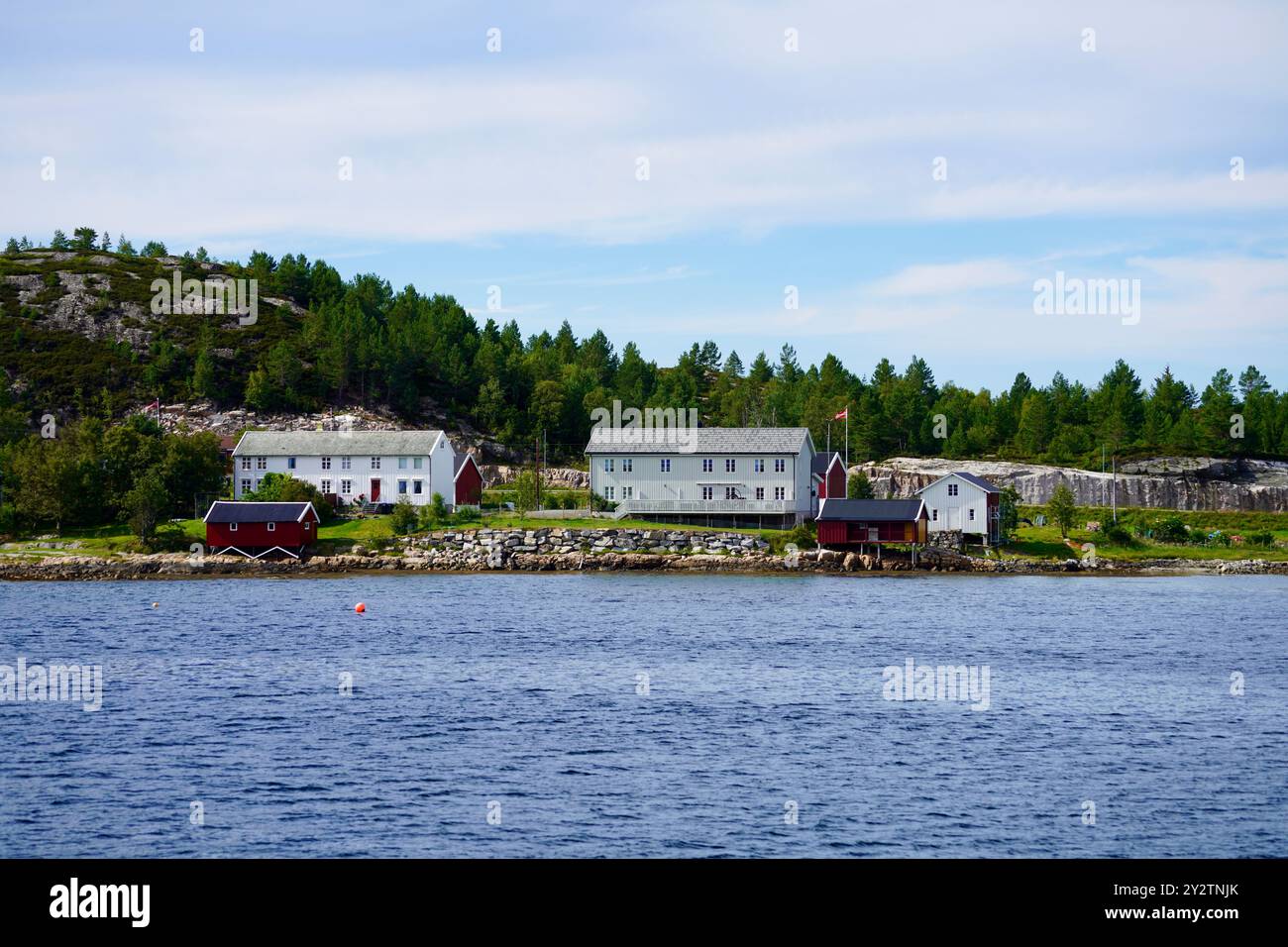 A picturesque coastal village with traditional houses by the water ...