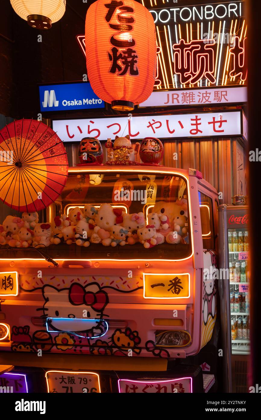 A vibrant Japanese food truck adorned with neon signs, lanterns, and ...