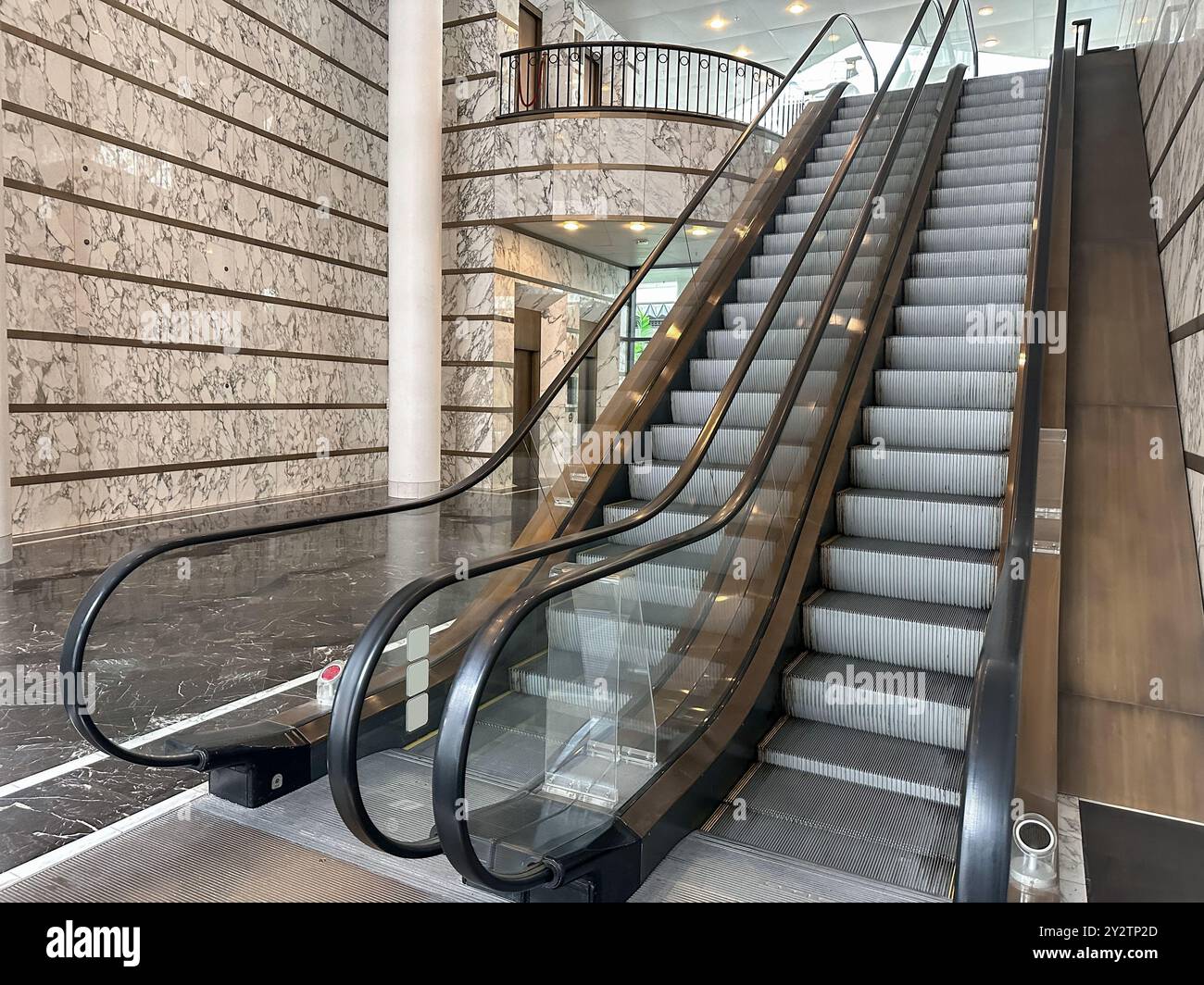 Modern escalators with handrails in shopping mall Stock Photo - Alamy