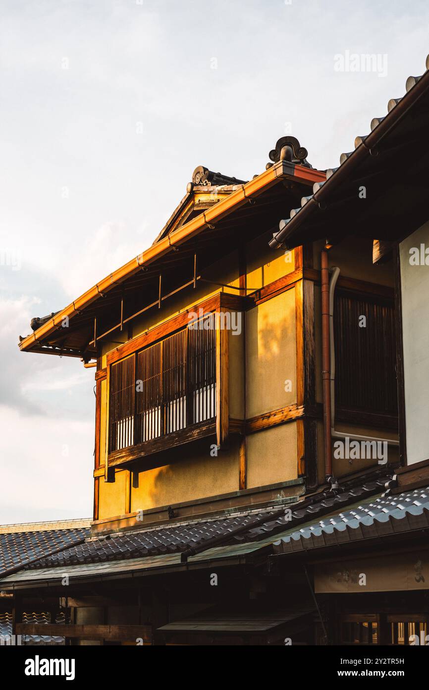 A traditional Japanese house with wooden details illuminated by the ...