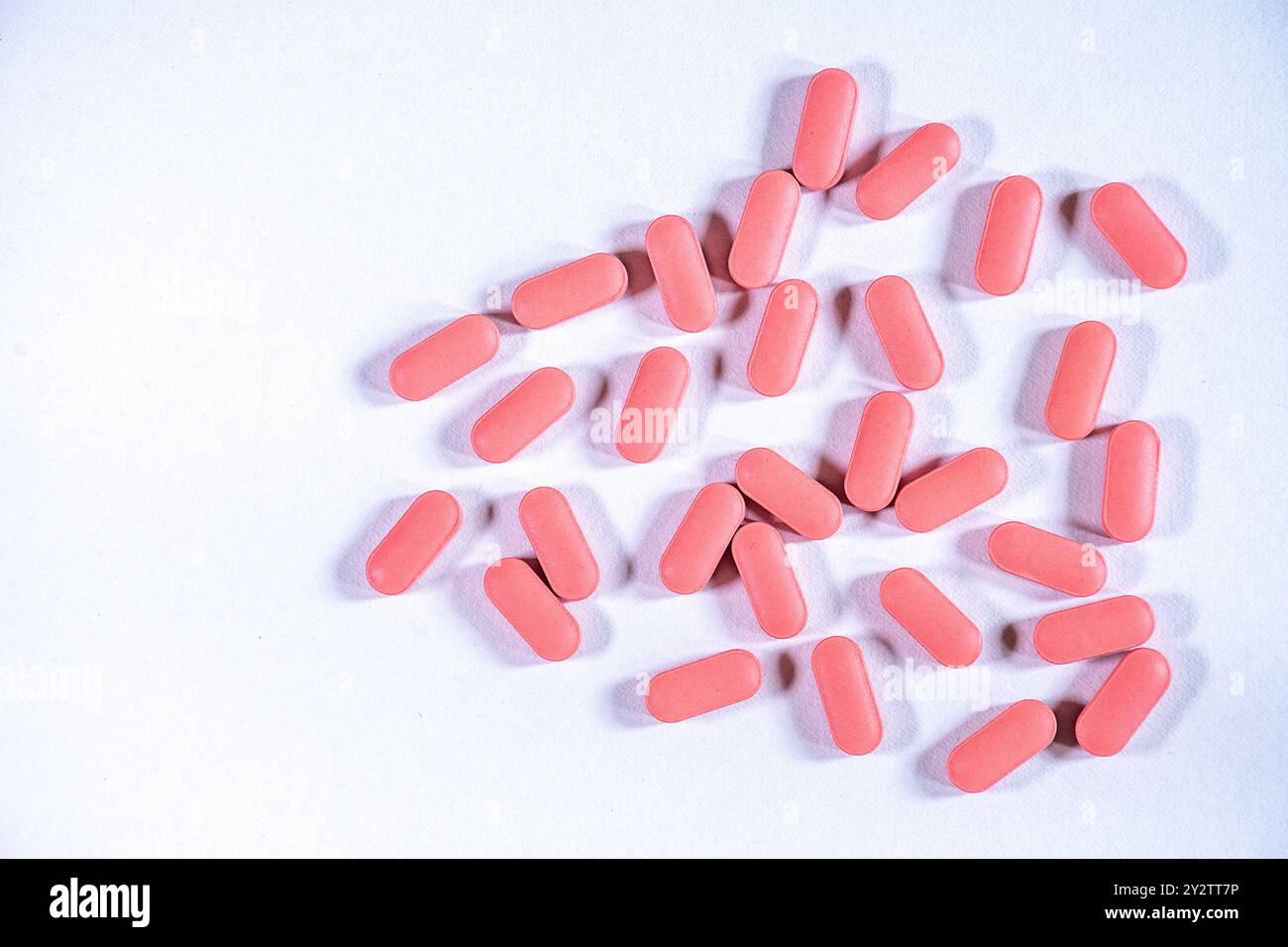 Top View of Scattered Red Tablets/Capsules Spilled on White Surface ...