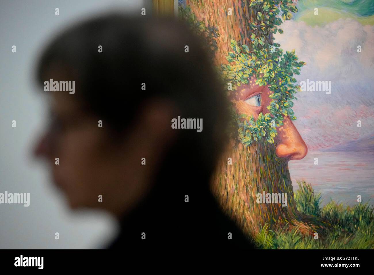 A visitor walks past « Alice au pays des merveilles » by Rene Magritte ...