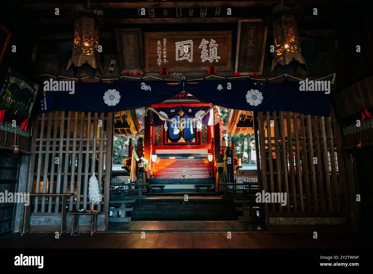 Interior of a traditional Japanese shrine with intricate wooden ...