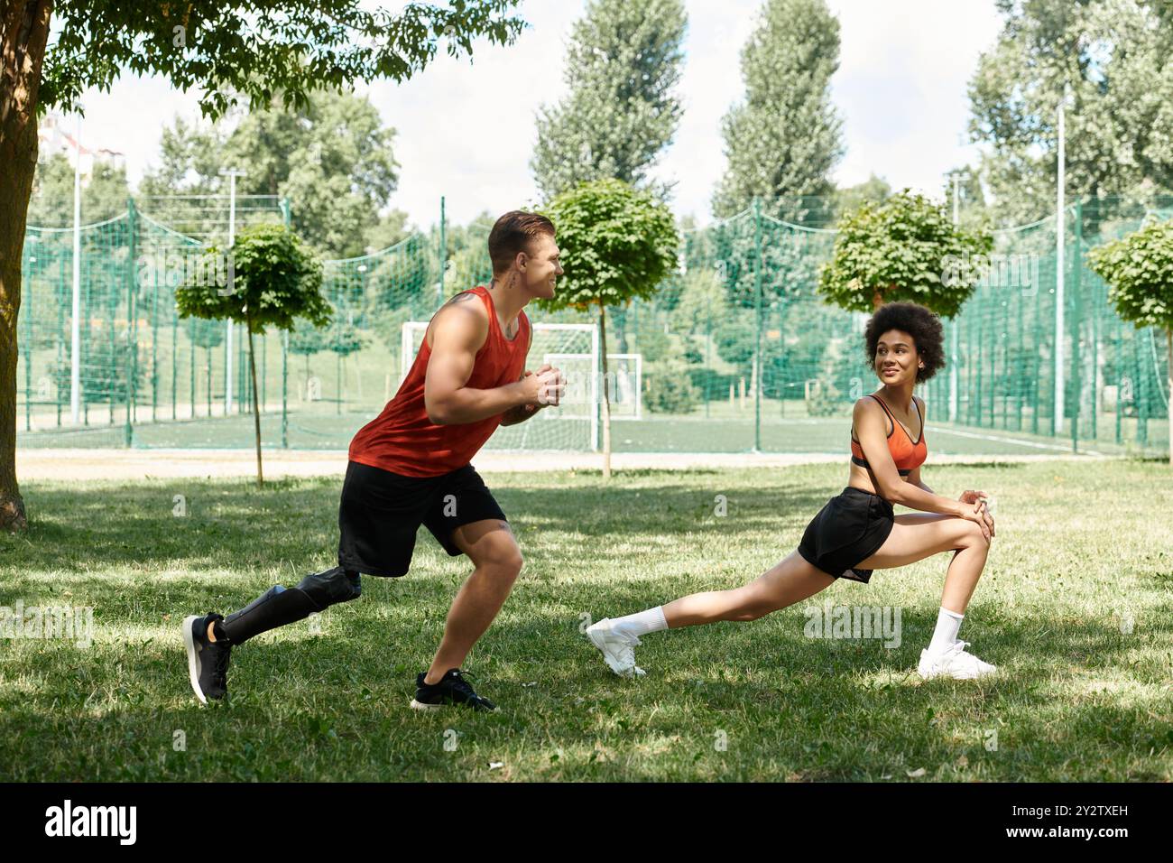 Friends engage in an outdoor workout, showcasing strength ...