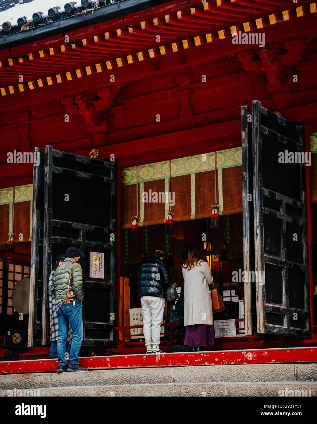 The Tourists and Buddhist Shinto worshipers at the ancient ornate ...