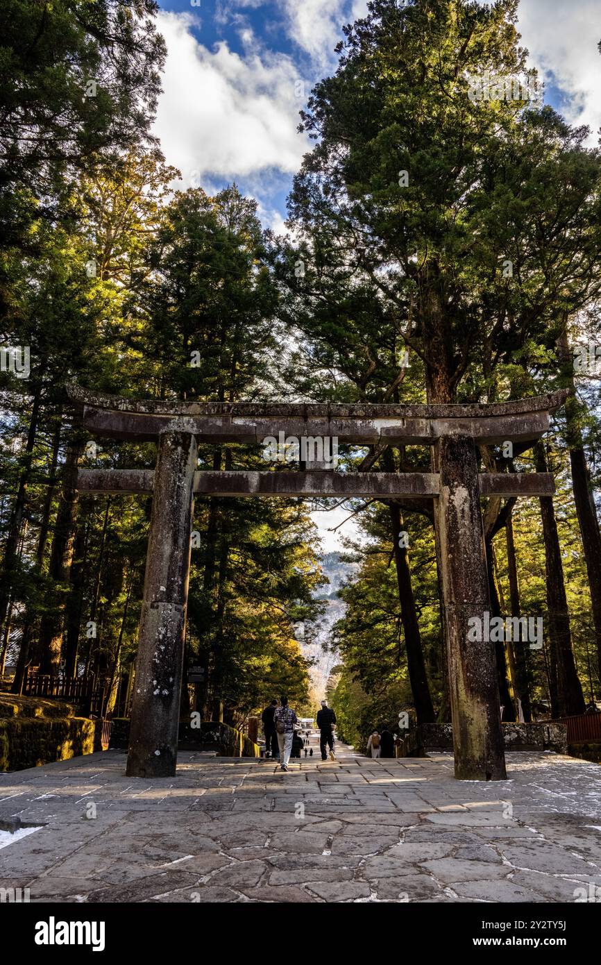 Japanese tourists and worshipers in stunning shot of massive torii gate ...