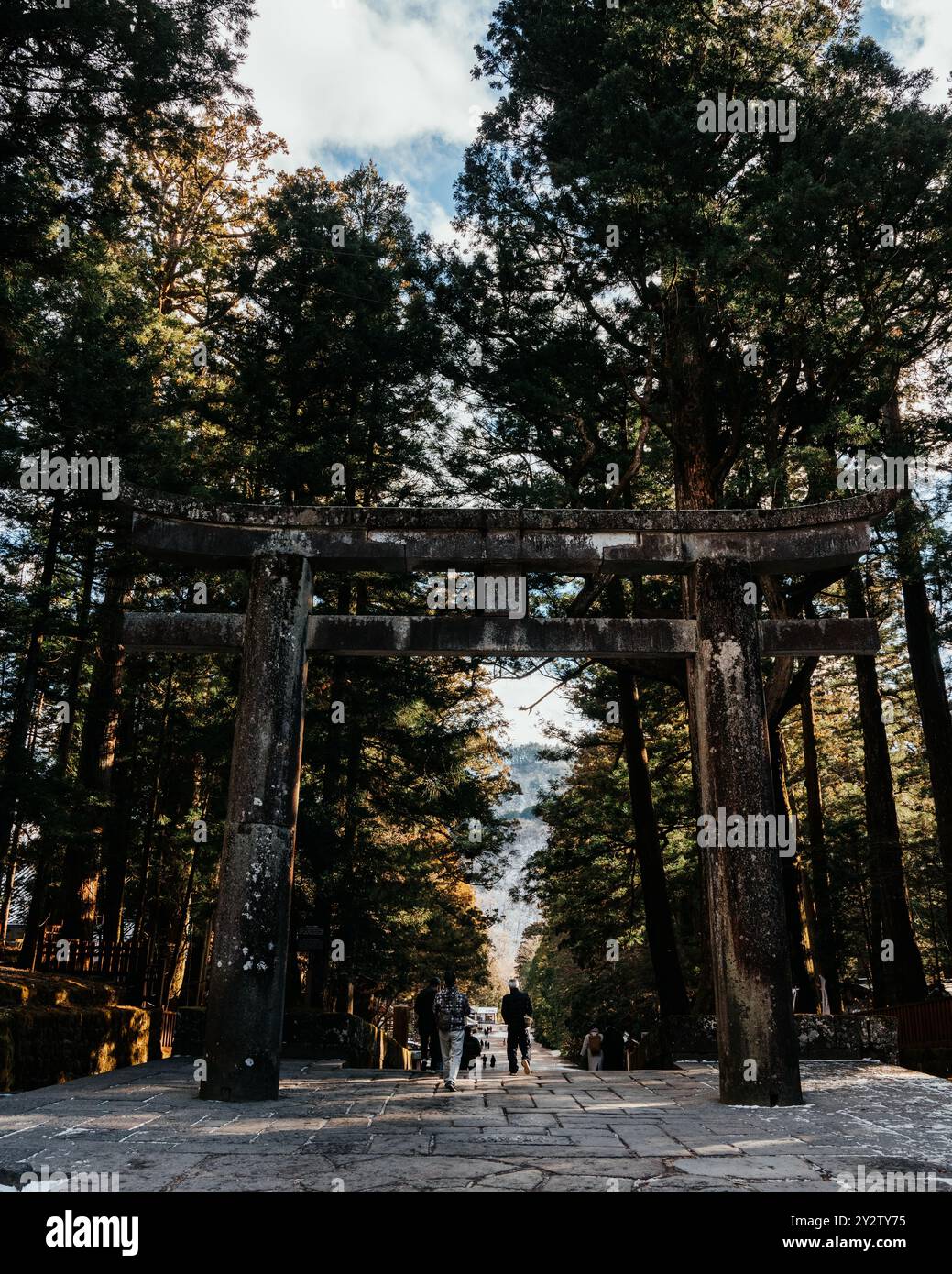 Japanese tourists and worshipers in stunning shot of massive torii gate ...