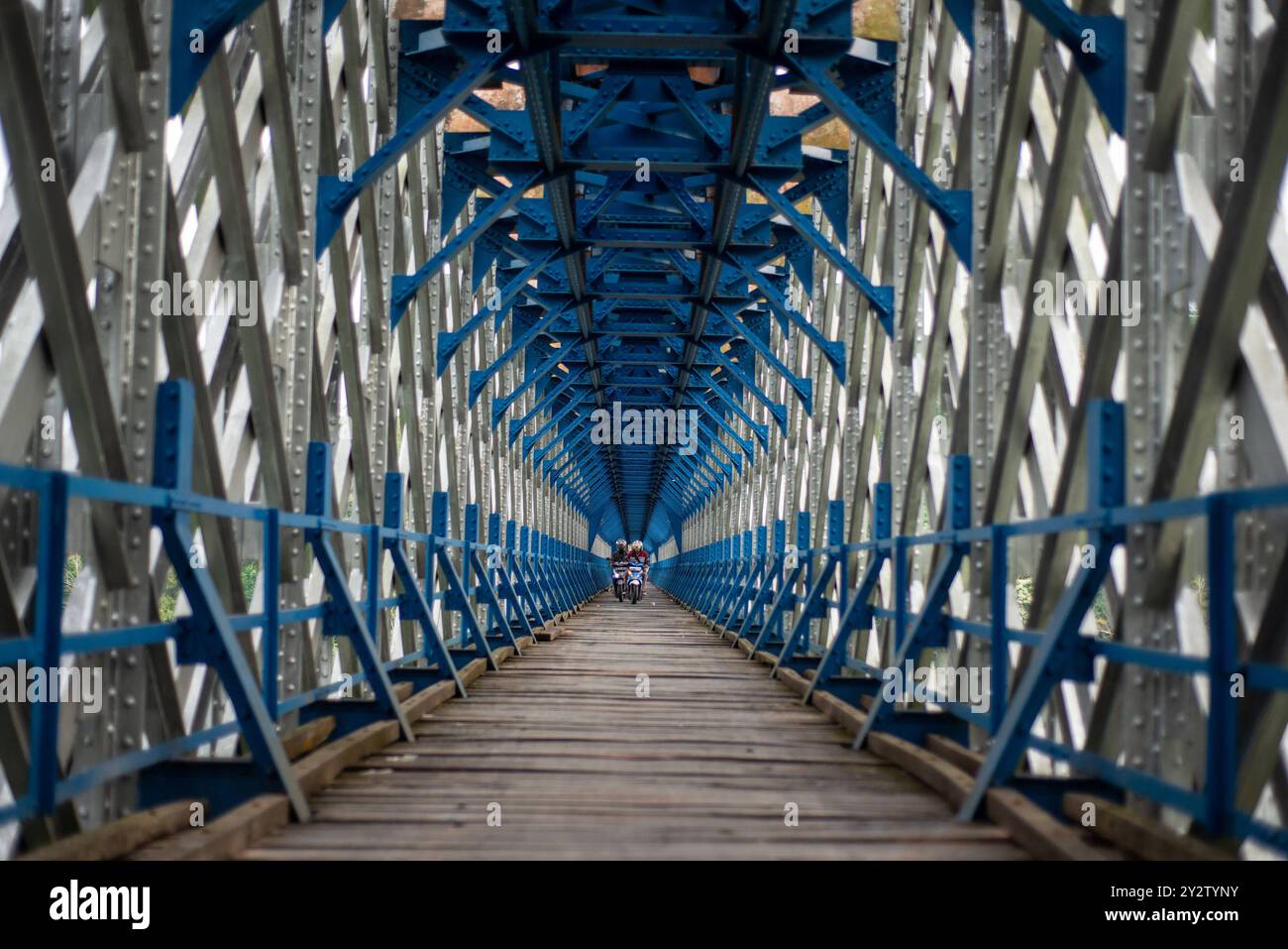 OLD RAILROAD BRIDGE IN WEST JAVA Motorcyclists cross the Cirahong ...