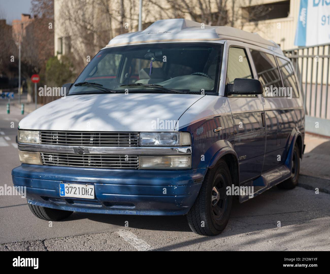 Front view of an old American blue and white Chevrolet Astro van parked ...
