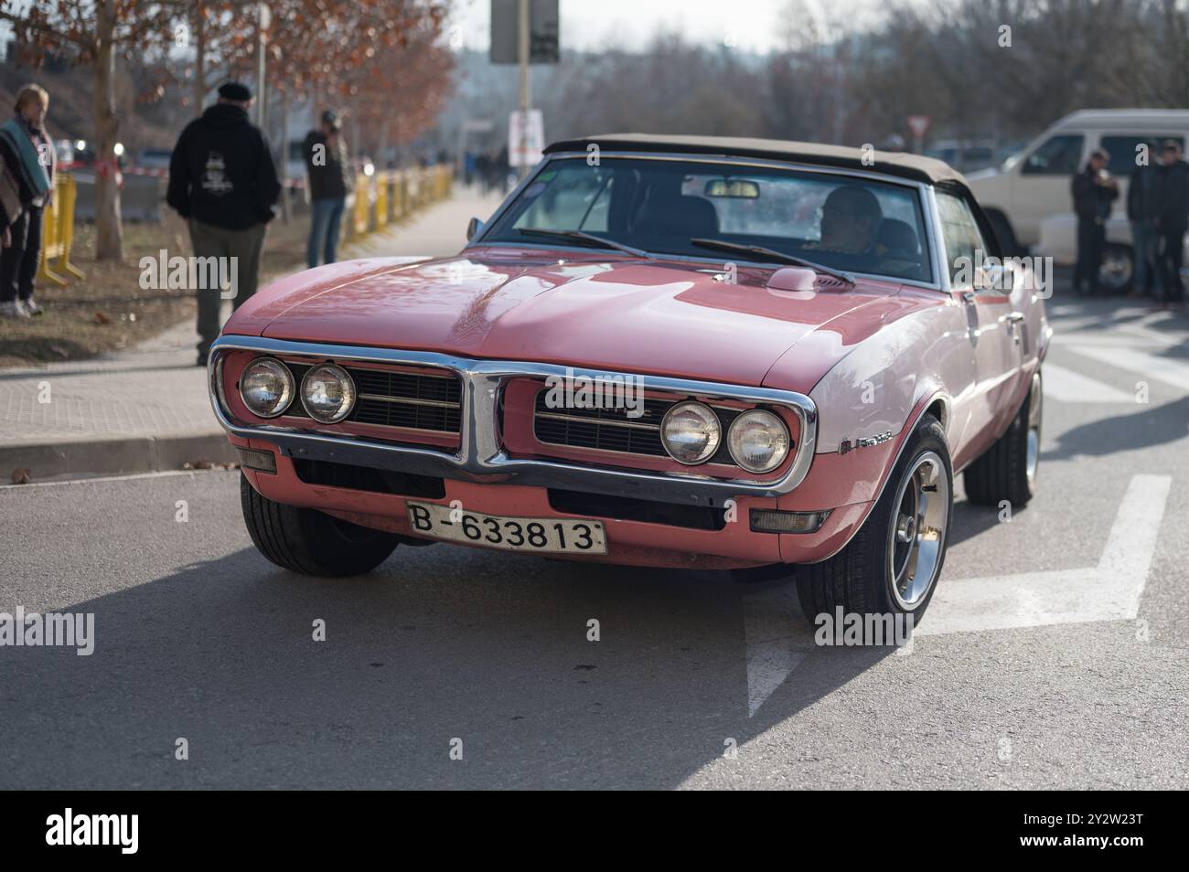 Front view of a classic first-generation pink American Pontiac Firebird ...