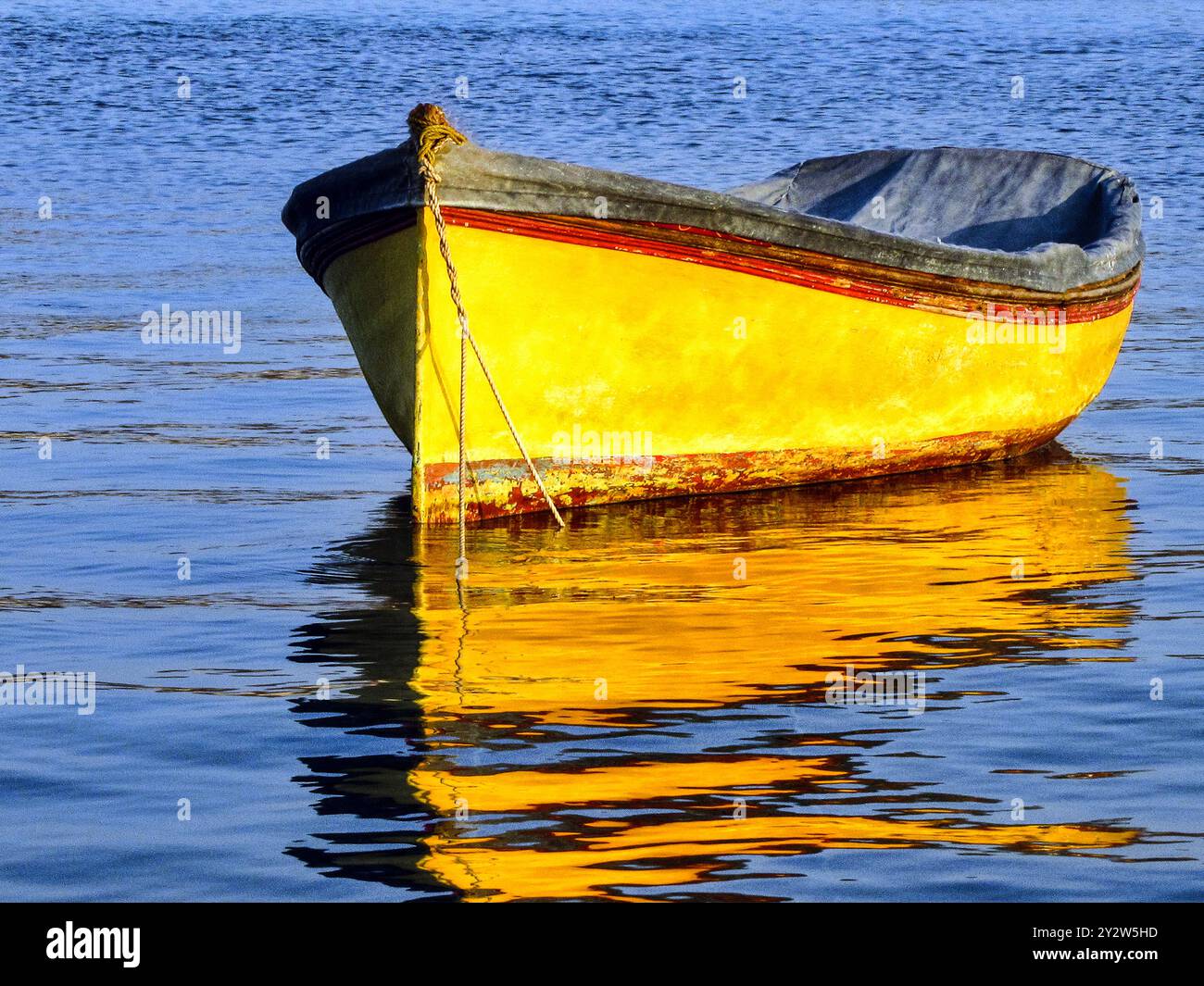 A yellow wooden boat for fishing and transportation on the sea Stock ...