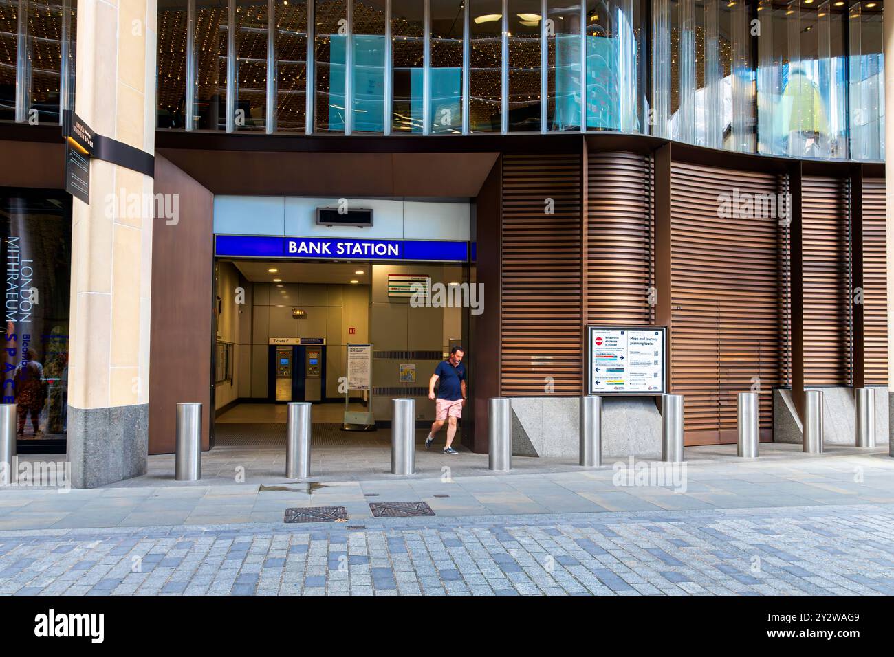 A man exiting the Walbrook entrance to Bank station, located beneath ...