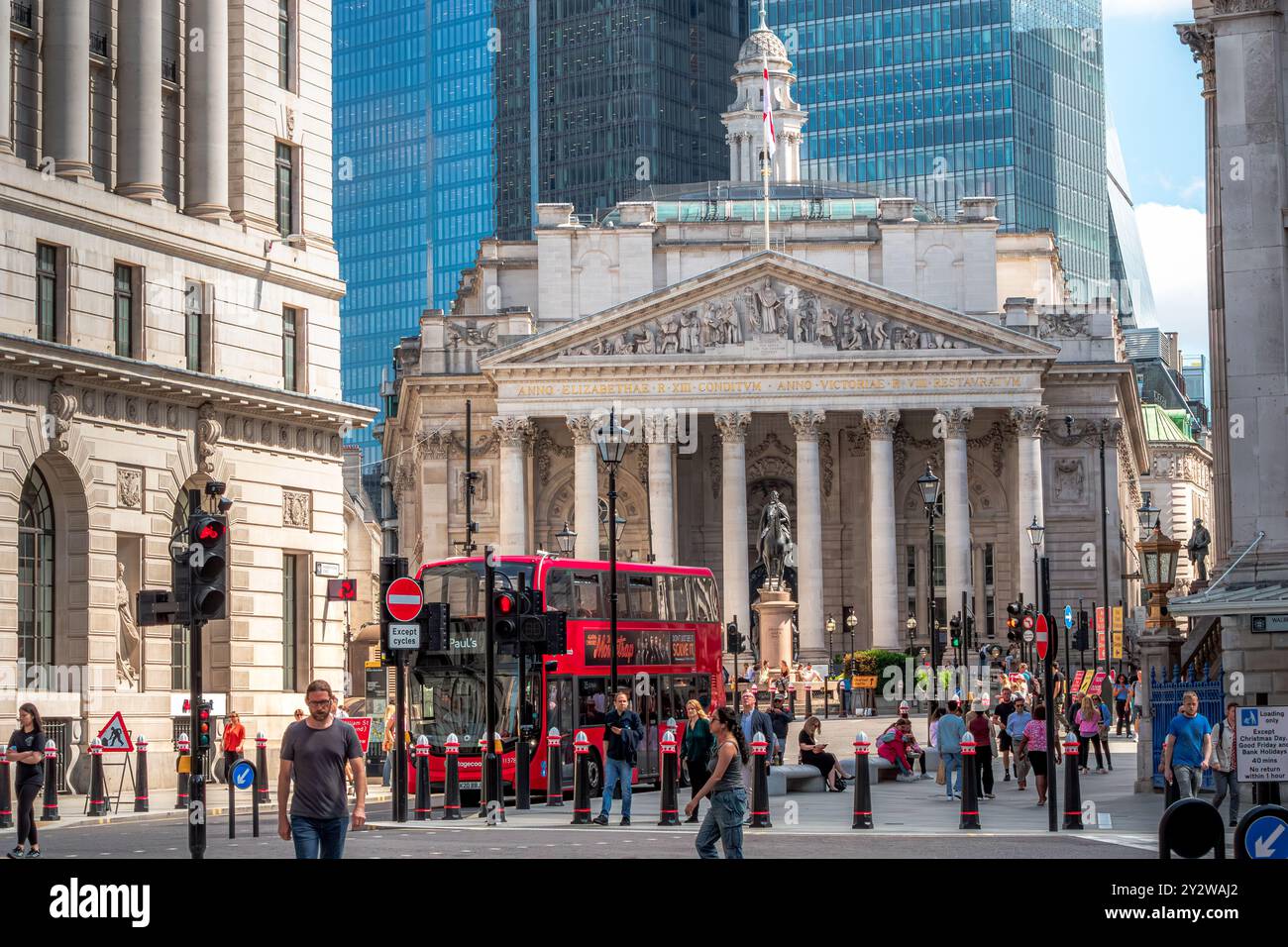 A London bus passes in front of The West facade of The Royal Exchange ...