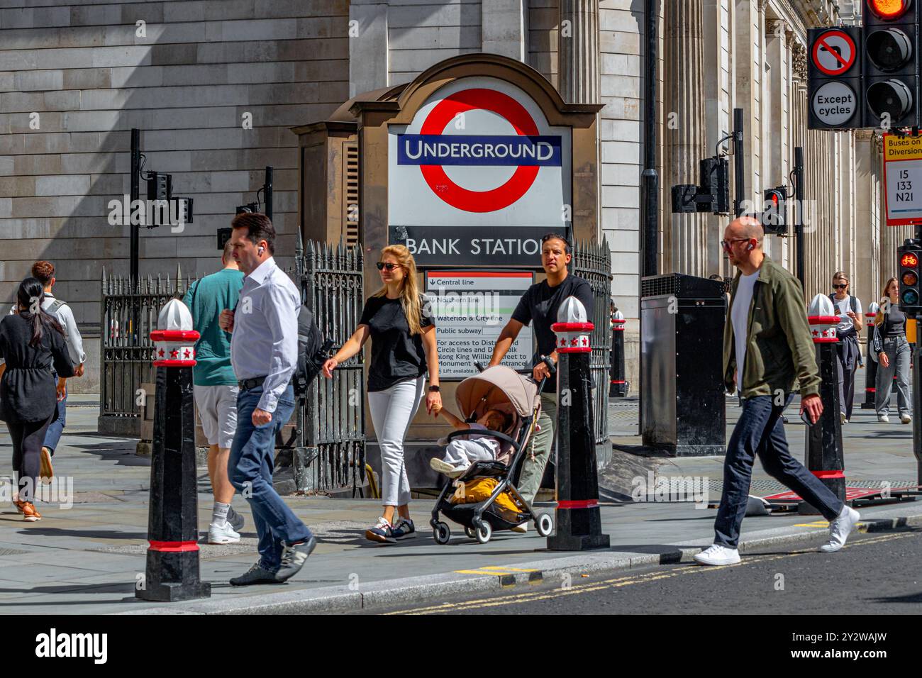 A couple with a pushchair walking past The Princes Street entrance to ...