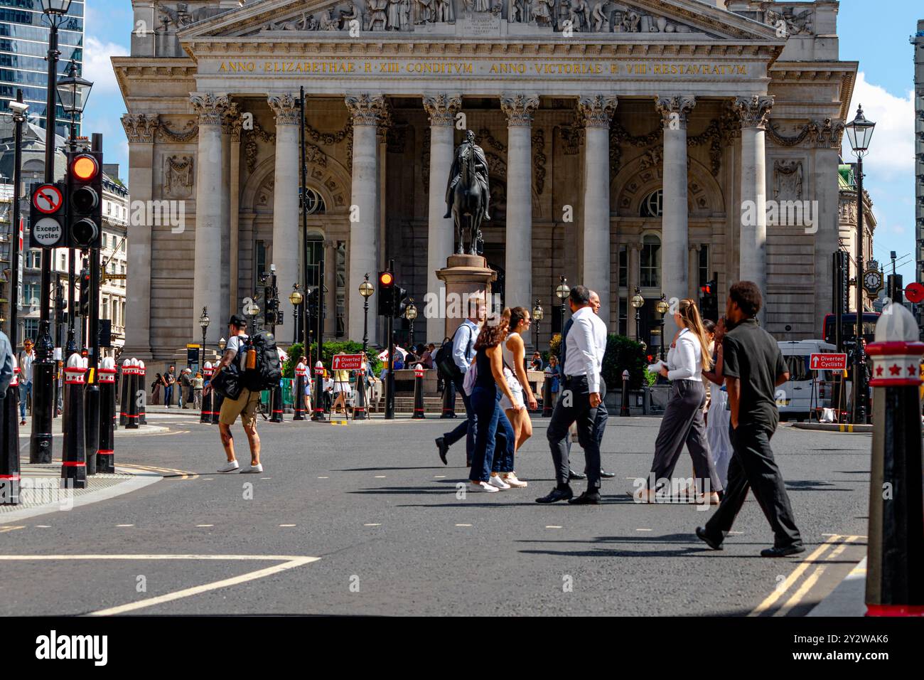 People walking across Bank Junction with the Royal The Royal Exchange ...