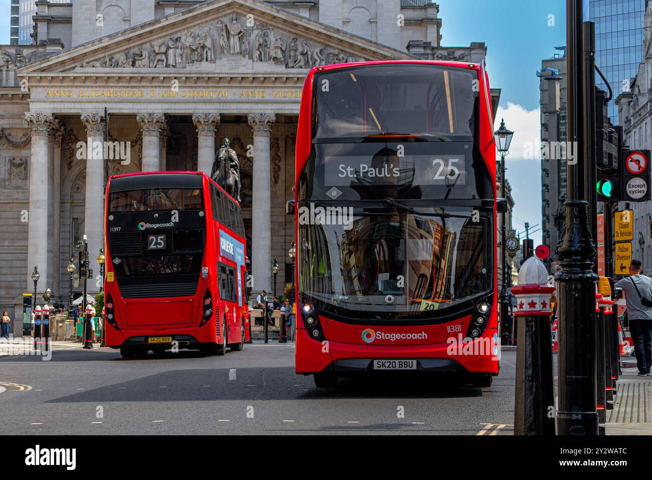 Two No 25 London double decker buses pass each other at Bank Junction ...