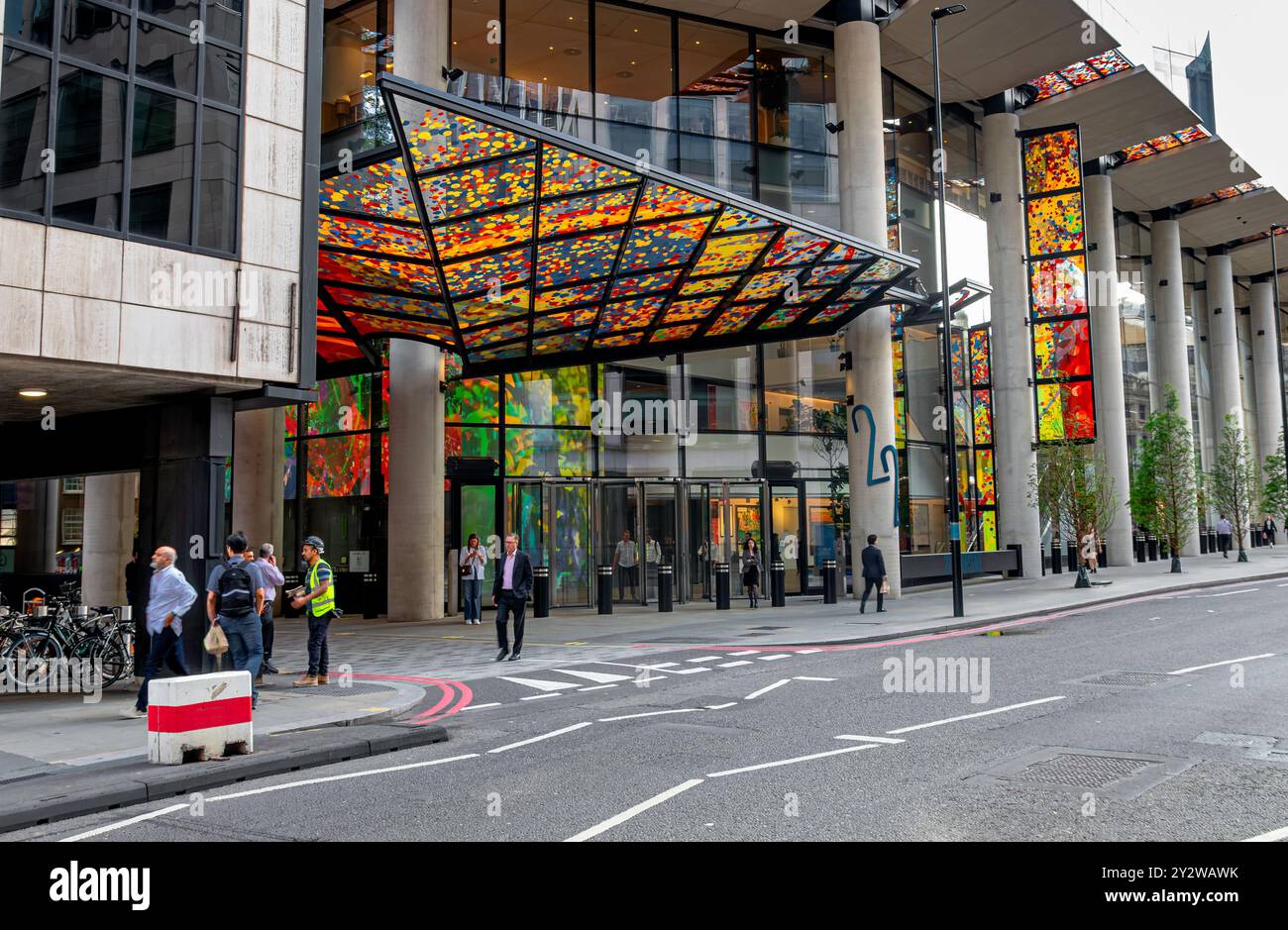People walking underneath the Colourful glass canopy at the entrance to ...