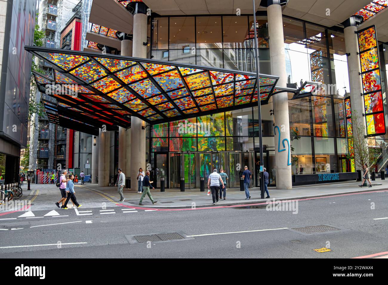 People walking underneath the Colourful glass canopy at the entrance to ...