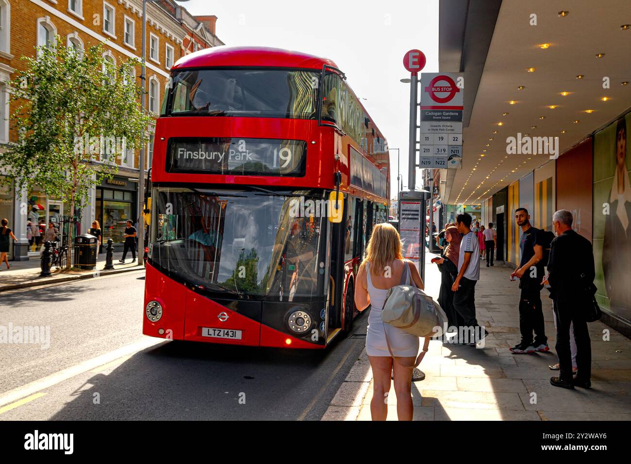 A number 19 London bus at a bus stop outside Peter Jones on The Kings ...
