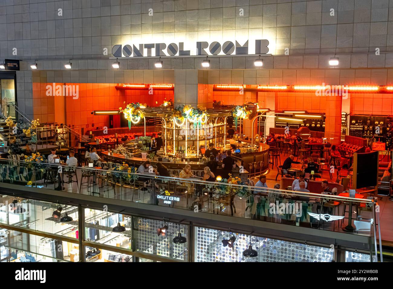 People enjoying food and drinks at Control room B a bar and restaurant ...