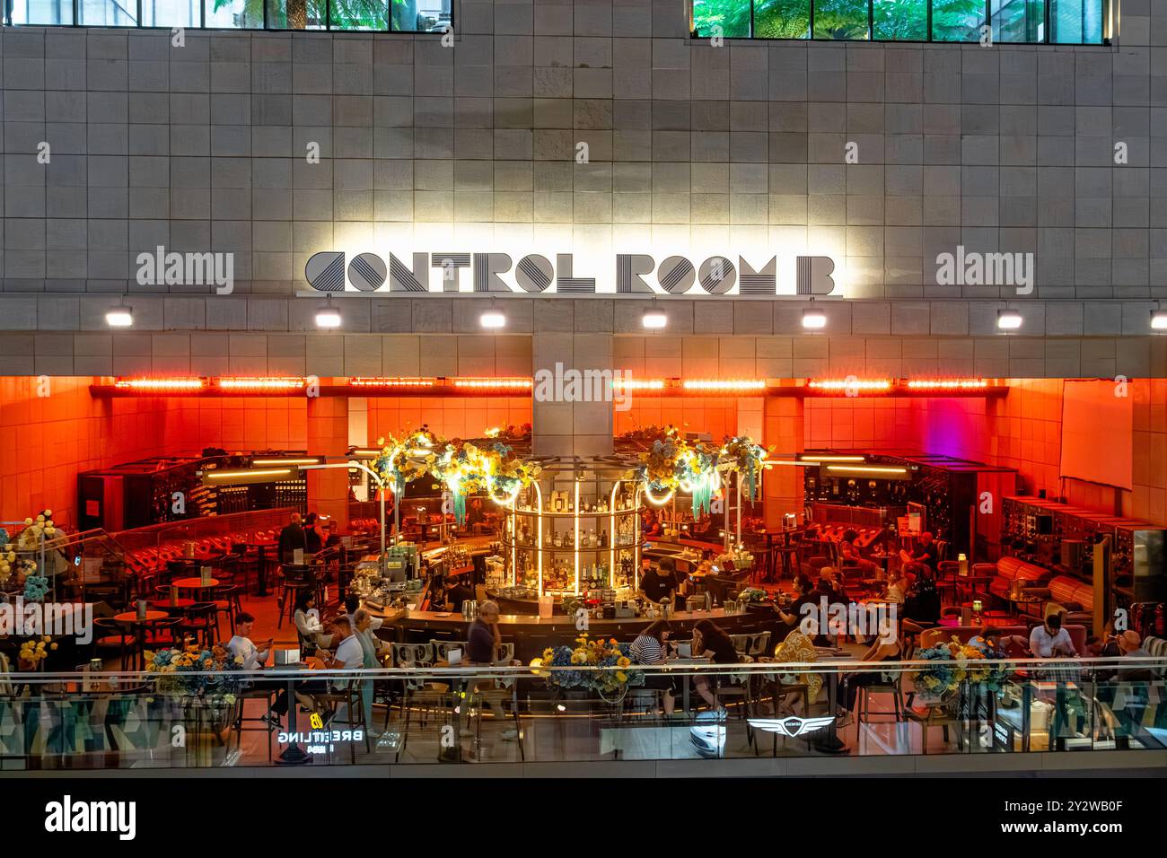 People enjoying food and drinks at Control room B a bar and restaurant ...