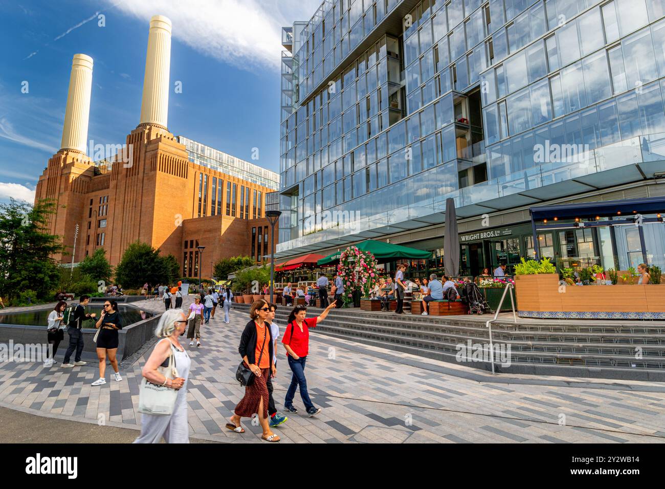 People enjoying a day out at Battersea Power Station eating and ...