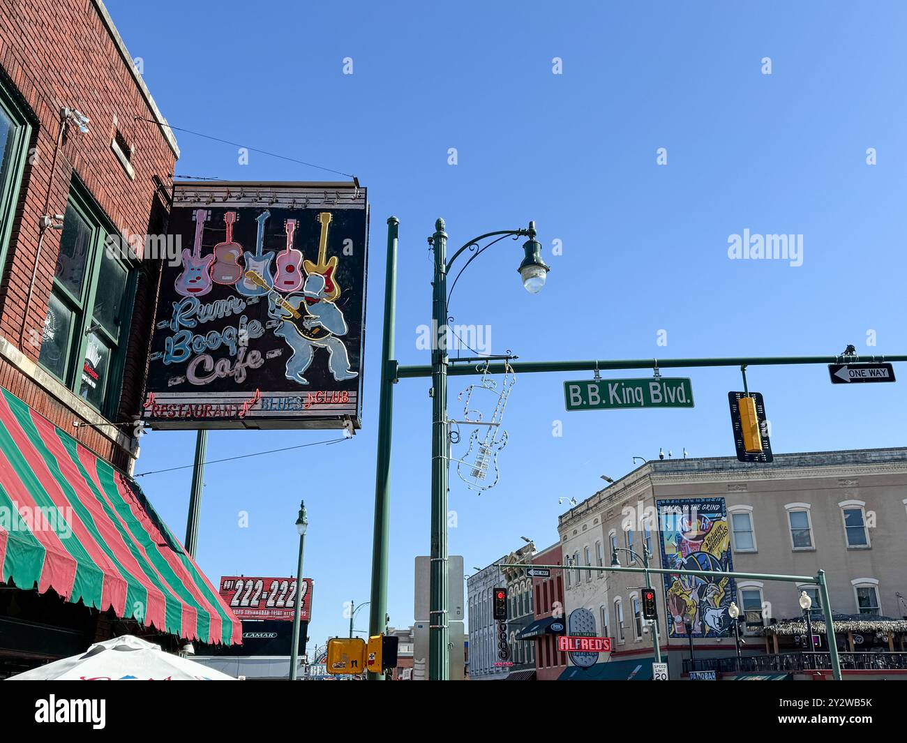 The Rum Boogie Cafe sign and street sign with a blue sky on famous B.B ...