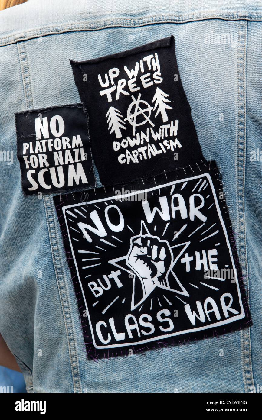 Anarchy UK. Angry young man, anarchist back of a blue jeans jacket worn ...