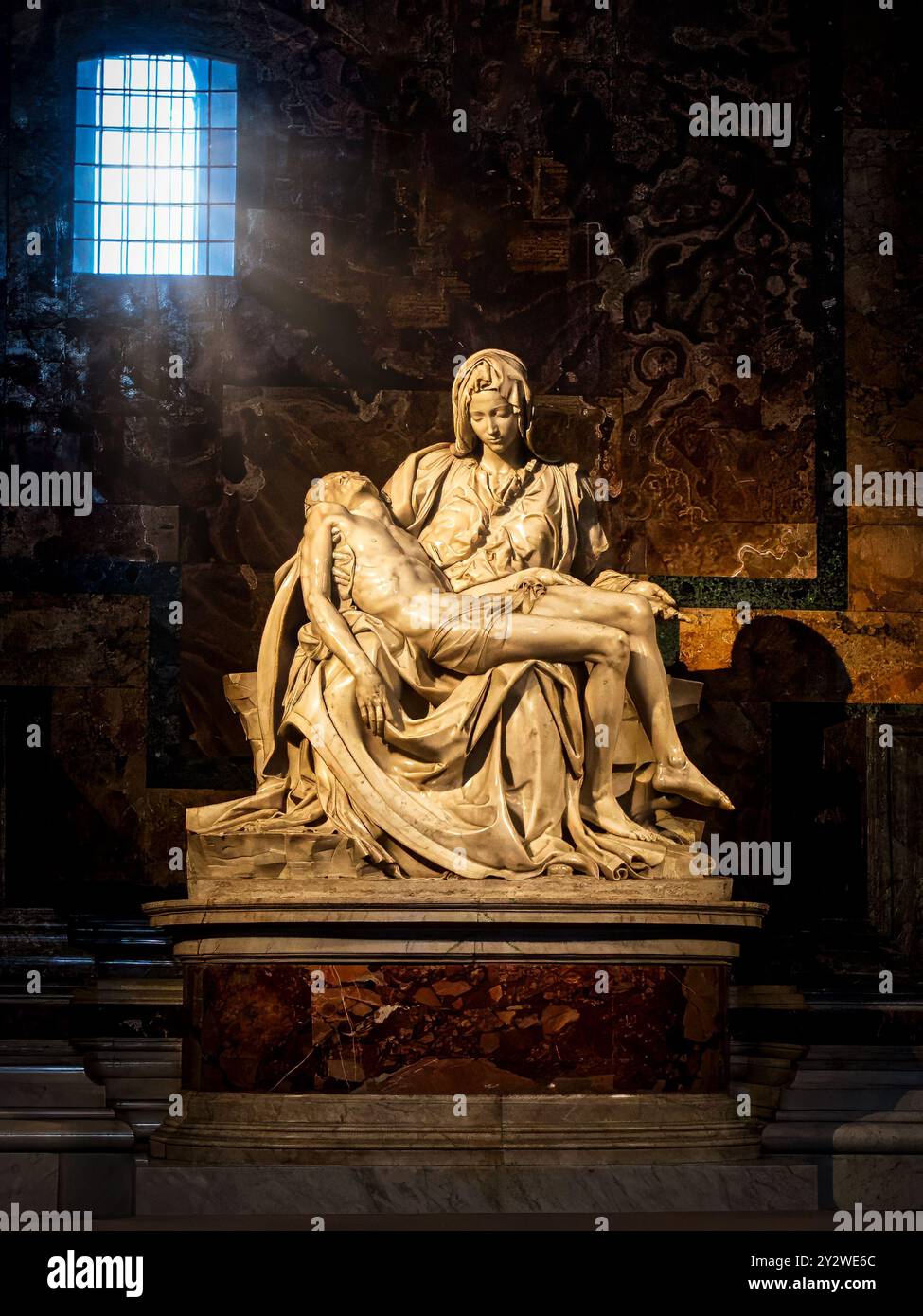 The Pieta sculpture by Michelangelo in St. Peter's Basilica, Vatican City, illuminated by ...