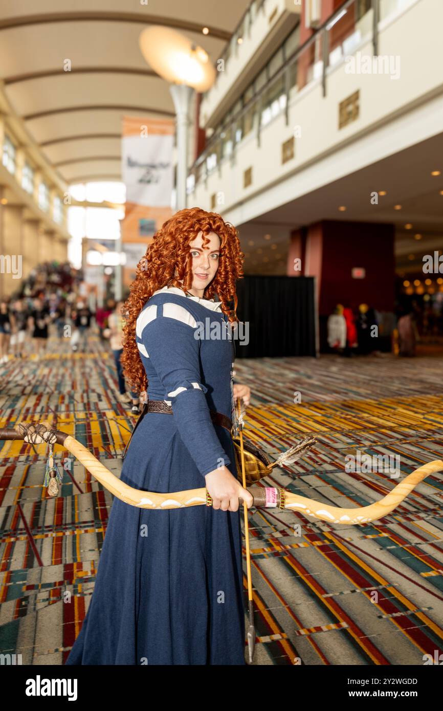 A woman dressed as an archer character from the Disney Movie Brave at ...