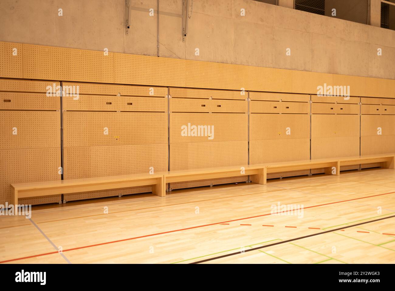 An empty indoor gymnasium with wooden benches Stock Photo - Alamy