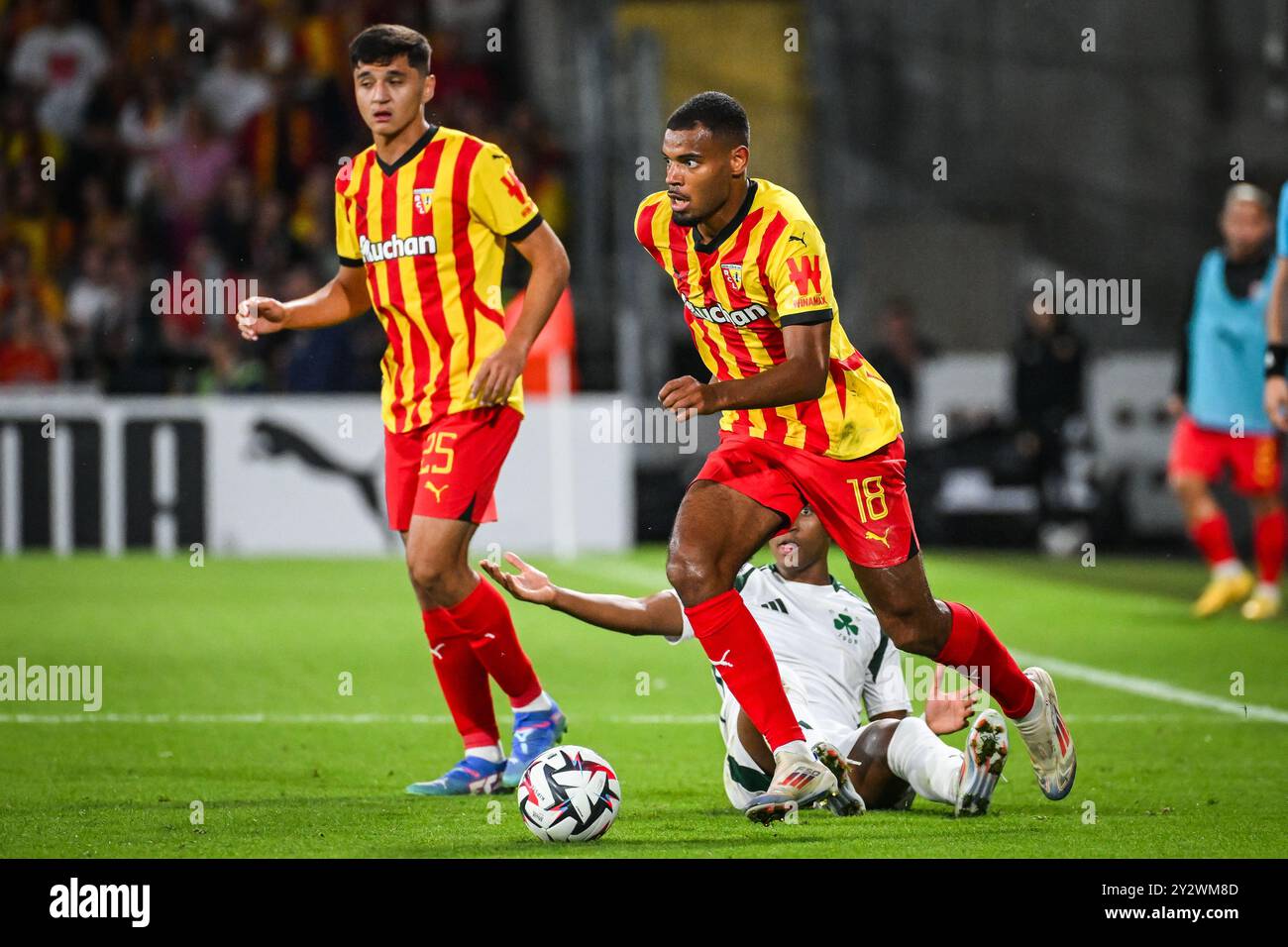 Lens, France. 22nd Aug, 2024. Abdukodir KHUSANOV of Lens and Andy DIOUF ...