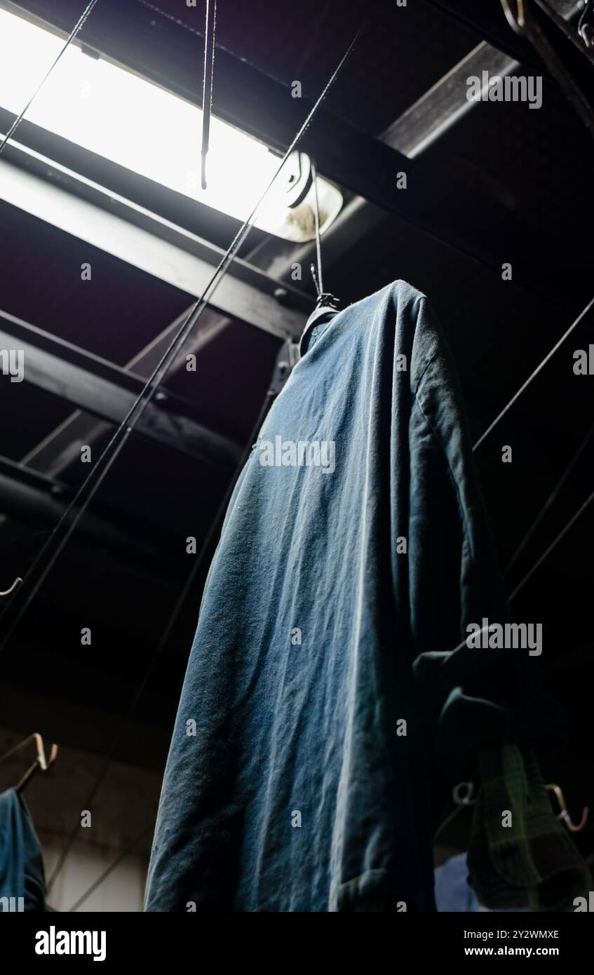 Vintage Denim Miner's Work Jacket Hanging in the Cloakroom. Color image ...