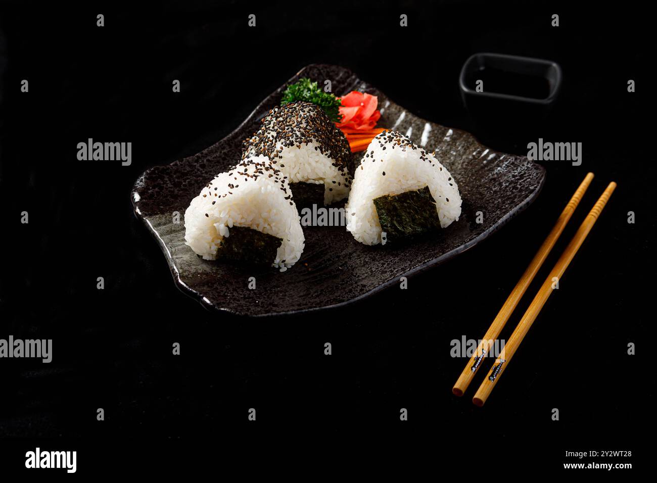 onigiri three balls or triangles of rice on black background japanese ...
