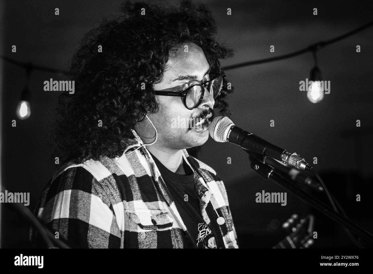 Young curly hair singer hi-res stock photography and images - Alamy
