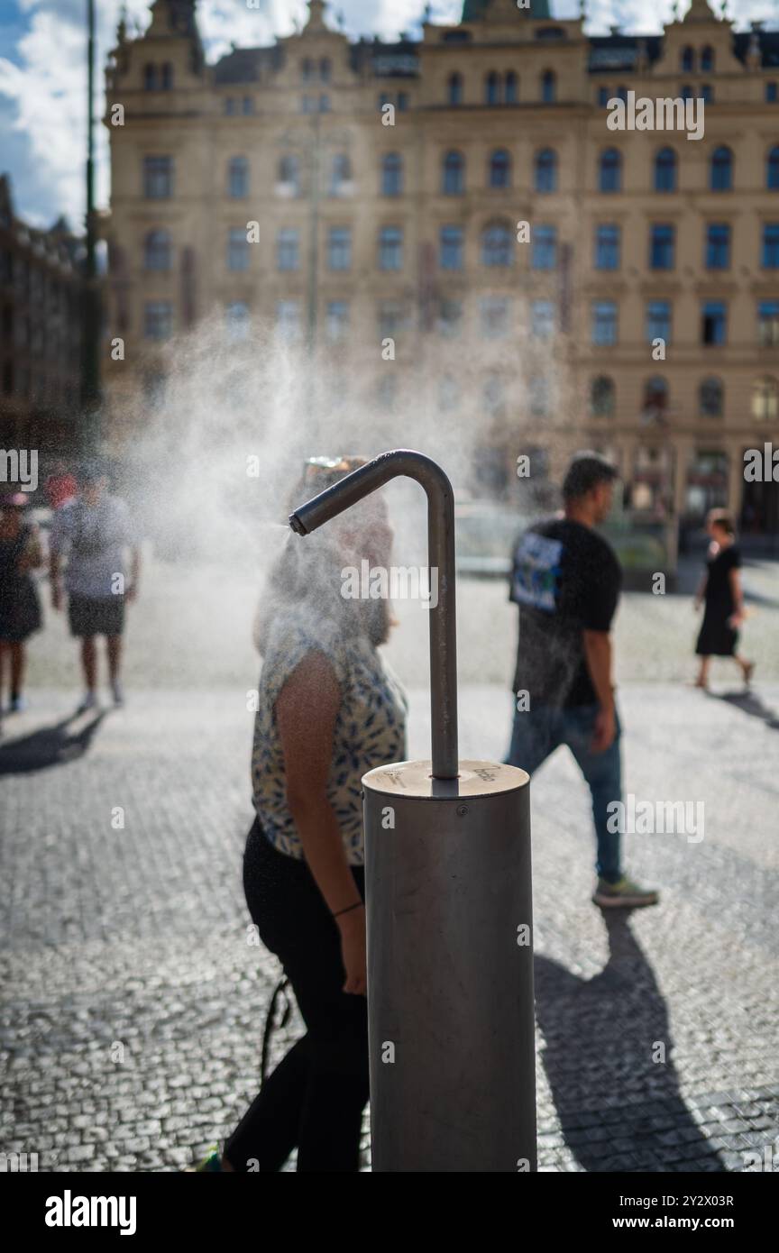 Refreshing water spray fountain to alleviate the high temperatures in ...