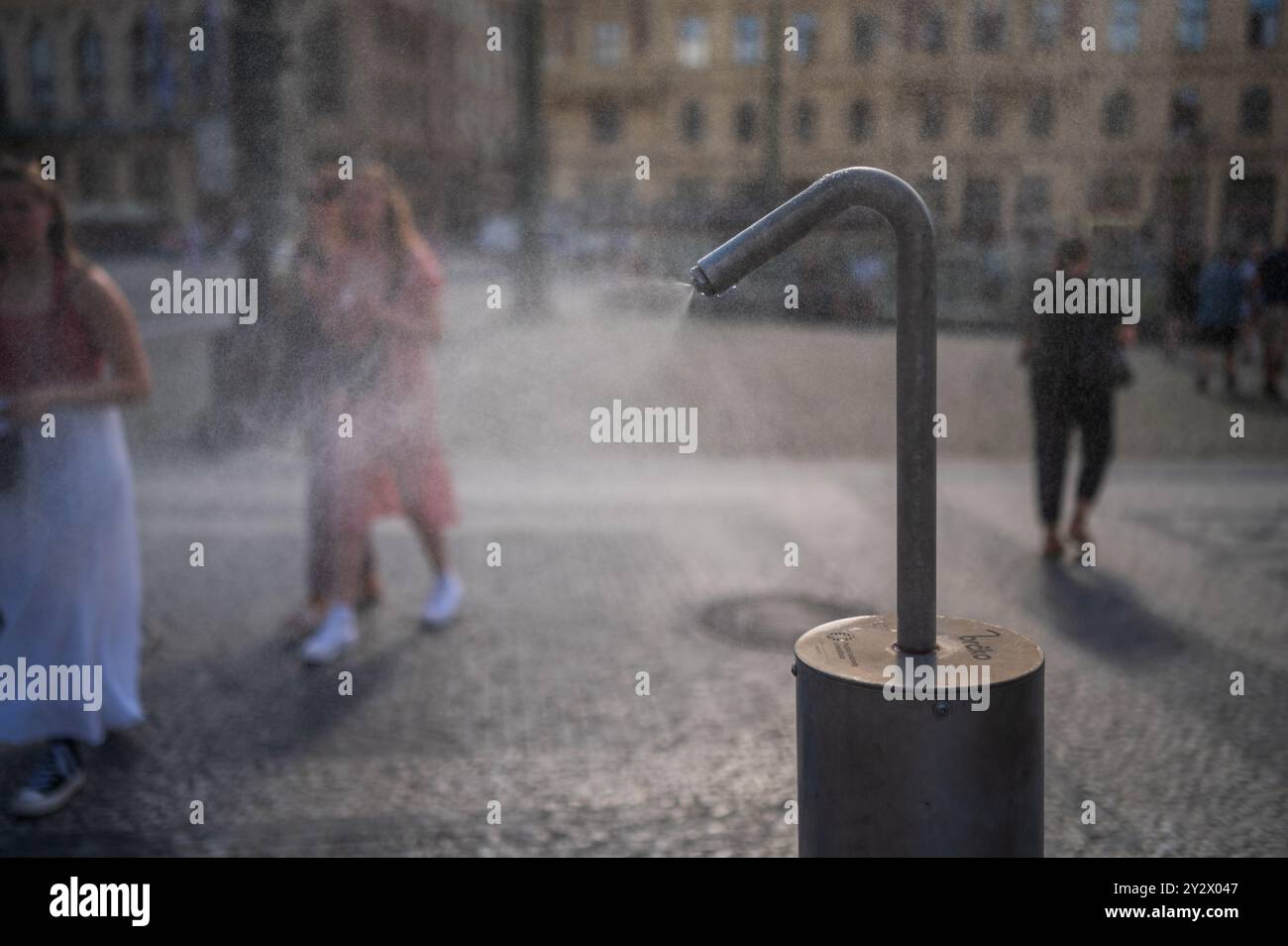 Refreshing water spray fountain to alleviate the high temperatures in ...