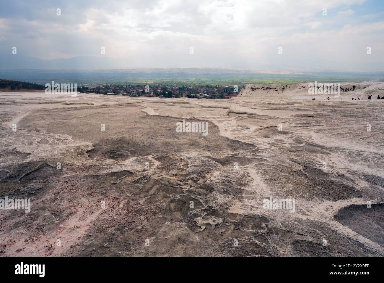 Wider view of travertine terraces, with mineral sediments in shades of ...
