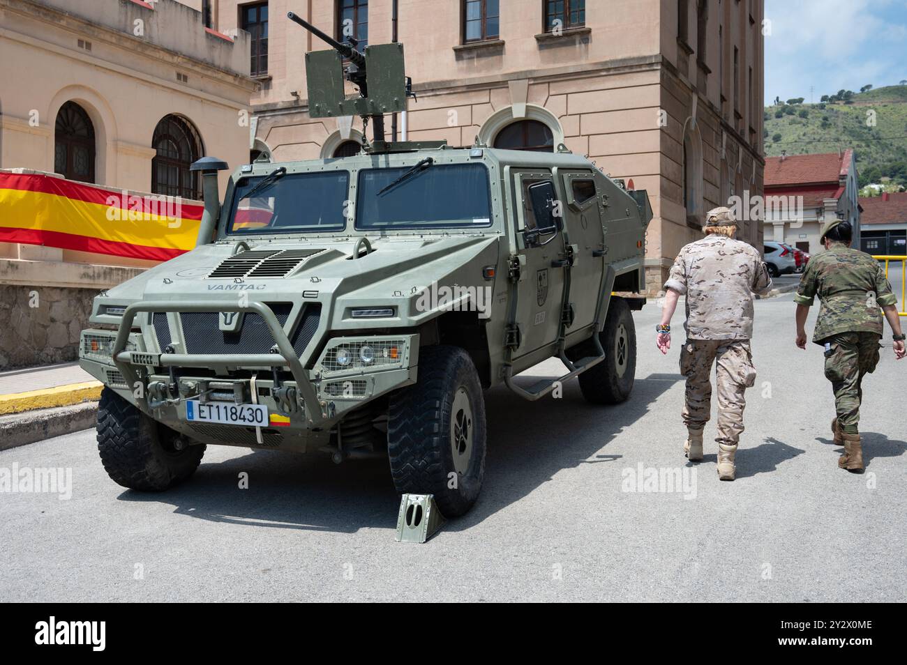 Detail of the Uro Vamtac ST5 BN1 light vehicle and two female soldiers ...