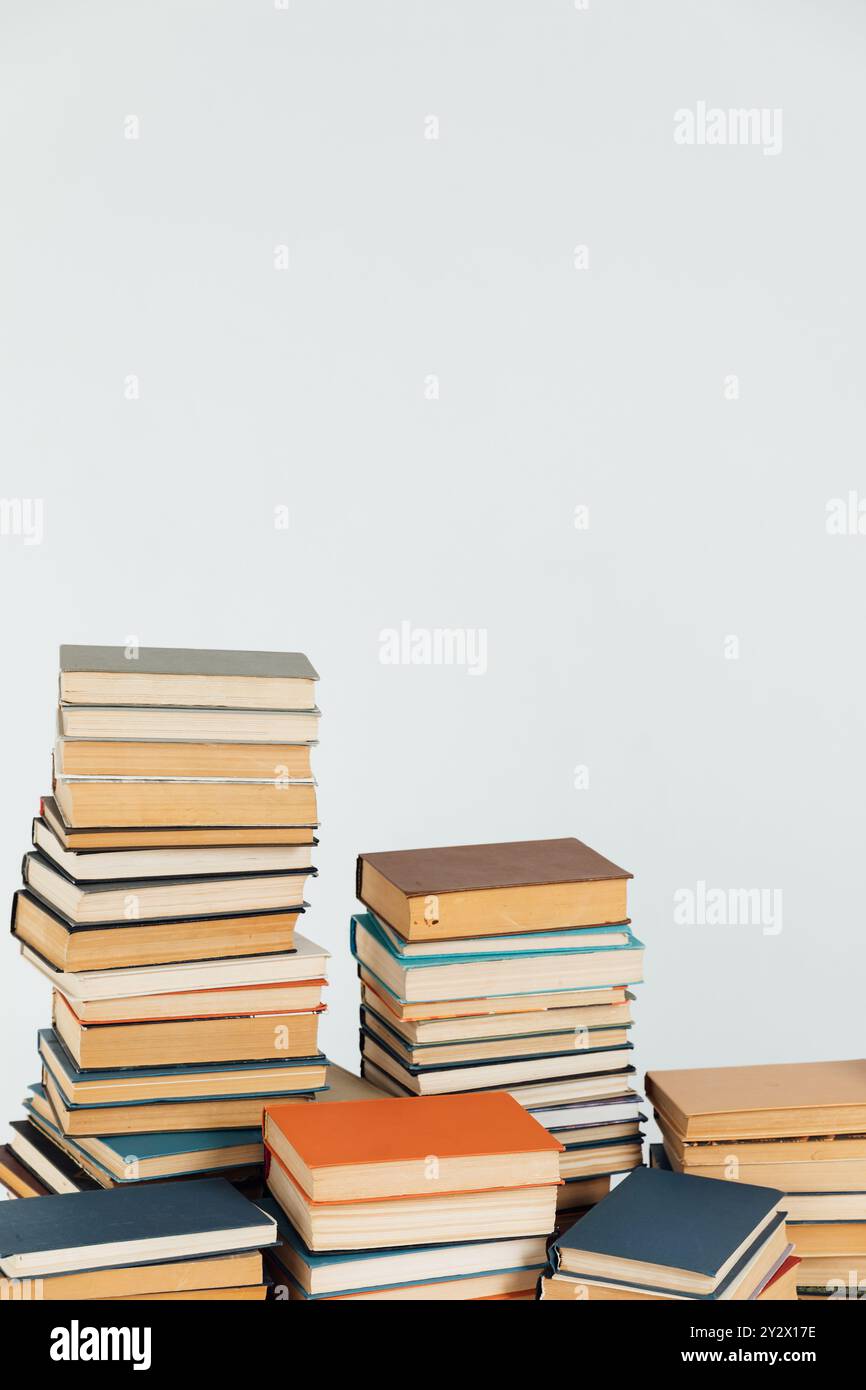 lots of old stacks of books on a white background of the library Stock ...